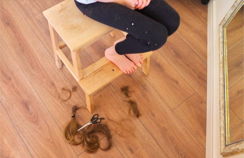 A girl came back from school and had her hair cut by a teacher